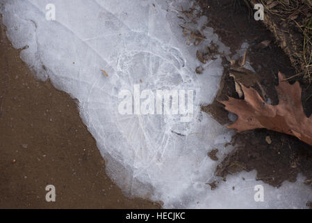 Black ice on sidewalk pavement after a snowfall in winter Stock Photo ...