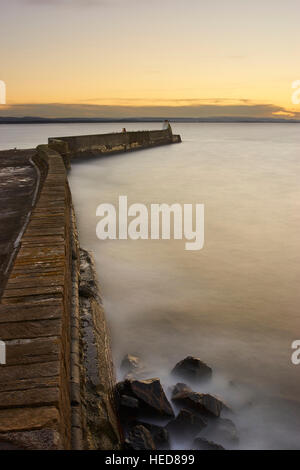 Sea wall at Burghead harbour, Moray, Scotland at sunset Stock Photo - Alamy