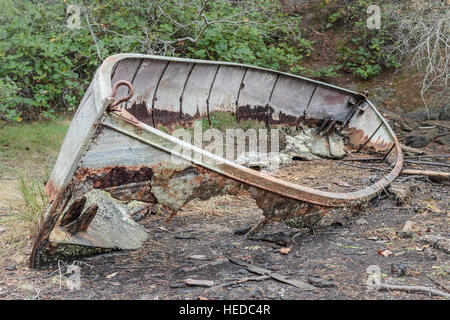 An old, rusty metal lifeboat decays on the beach Stock Photo - Alamy