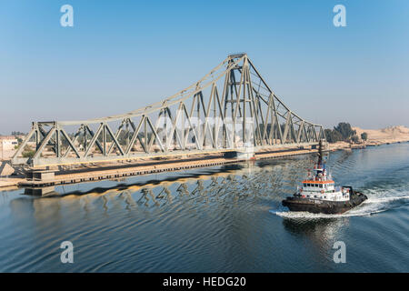 Tug Boat passes El Ferdan Railway Bridge in the Suez Canal near ...