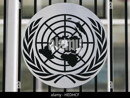 The United Nations UN symbol logo projected over a skull isolated ...