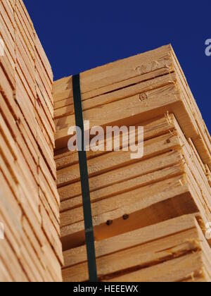 Stacks of planks against the deep blue sky Stock Photo - Alamy