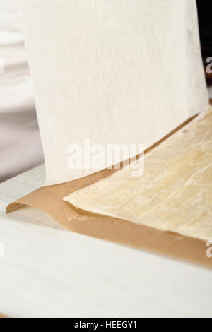 Stacking filo pastry sheet. Making Filo Pastry Topped Apple Pie Series ...