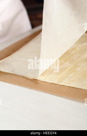 Stacking filo pastry sheet. Making Filo Pastry Topped Apple Pie Series ...