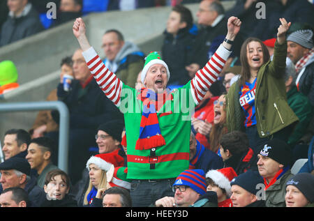 A fan dressed as an elf in the stands during an NFL football game ...