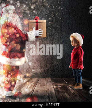 Santa Claus baby with gift box isolated on white background Stock Photo ...