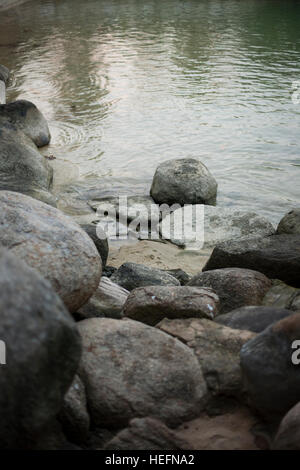 Abstract nature - water flows around a stone in the river Stock Photo ...