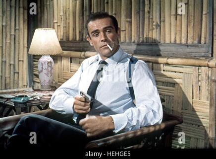 Sean Connery actor sitting in chair holding glass of whisky moustache ...