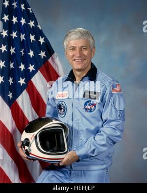 Official NASA portrait of NASA astronaut Henry Hartsfield in a blue ...
