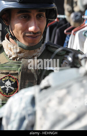 An Iraqi army non-commissioned officer (right) and U.S. Army 1st Lt ...