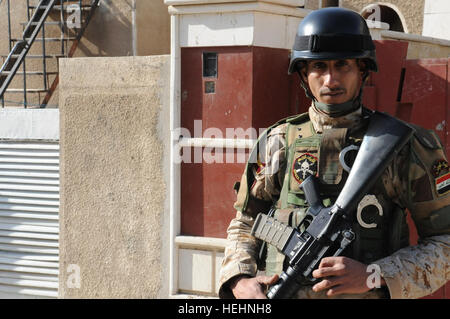 An Iraqi army non-commissioned officer (right) and U.S. Army 1st Lt ...