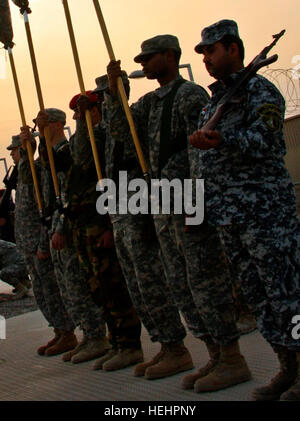 An Iraqi policeman stands guard on a watchtower as Shiite pilgrims ...