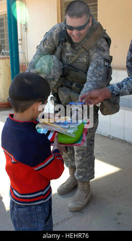 Family members of Iraqi National Police Major Sinan Yassin, 45, grieve ...
