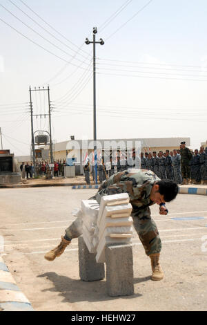 An Iraqi police instructor with the Mosul public service academy ...