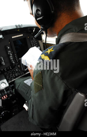 A pilot conducts a pre-flight inspection on an MH-60S Sea Hawk of ...