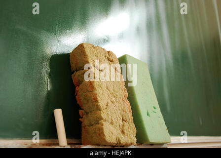 Blackboard green sponge and white chalk Stock Photo - Alamy