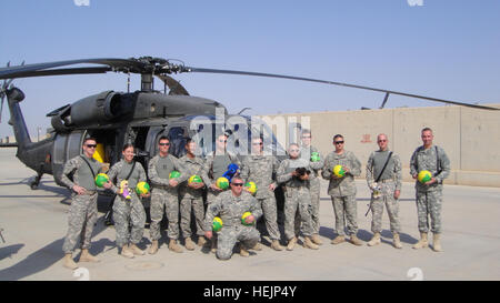 Soldiers and civilians pose for a photo before Maj. Gen. Stuart W ...