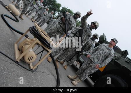 Brig. Gen. Paul C. Hurley (left) shakes hands with a member of the ...