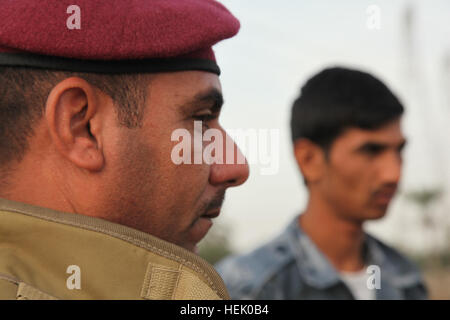 Iraqi soldiers from the 52nd Infantry Battalion conduct a foot patrol ...