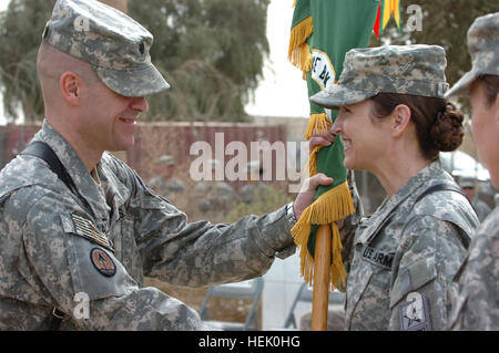 Lt. Col. Mark Jackson passes the battalion colors to Brig. Gen. Colleen ...