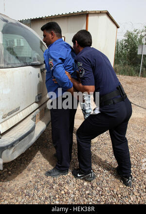 Iraqi police demonstrate vehicle search procedures they learned during ...