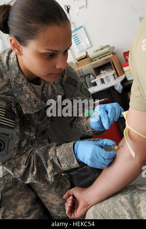 A medic from C Company, 407th Brigade Support Battalion, 2nd Brigade ...