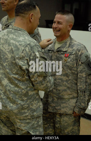 Col. Paul Calvert, left, commander of 2nd Advise and Assist Brigade ...