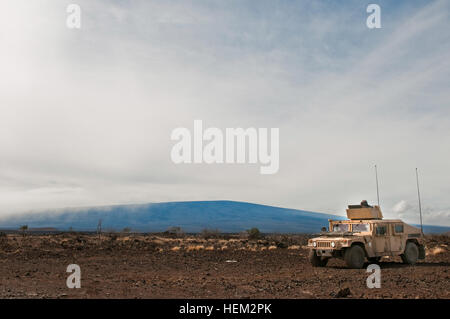 POHAKULOA TRAINING AREA, Hawaii -- A humvee from the 57th Military ...
