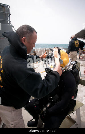 An Army deep-sea diver from the 569th Engineer Detachment pauses to ...