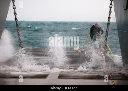 Army deep sea divers of the 569th Engineer Detachment aboard LCU-2018 ...