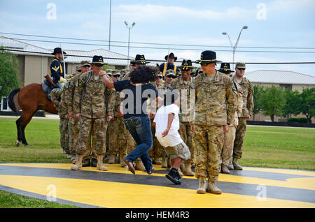 Command Sgt. Maj. Isaia Vimoto (seated) tests out the United Through ...