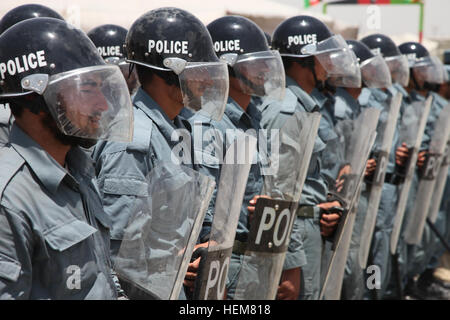 Afghan Uniform Police officers dressed in riot gear stand in formation ...