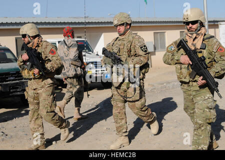 Albanian Special Forces members provide security during a meeting with ...