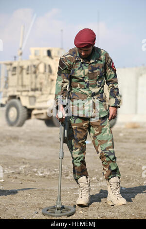 An Afghan National Army commando engineer demonstrates procedures for ...