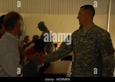 U.S. Army Capt. Brian McCall, commander, and U.S. Army 1st Lt. Neal ...