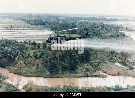 Vietnam: A US Huey helicopter spraying agent orange during Operation ...