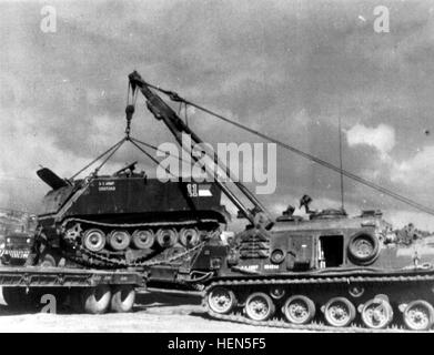 An M88 armored recovery vehicle is used to tow and recover M1 Abrams ...