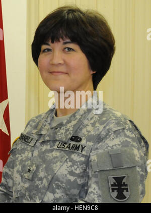 During a promotion ceremony, a Brigadier General uncases a one-star ...