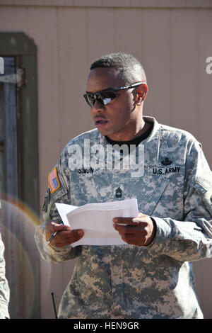 Master Sgt. Dwight Simon gives directions at Camp Mackall during ...