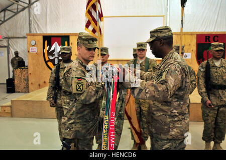 A 548th Combat Sustainment Support Battalion Soldier (middle) embraces ...