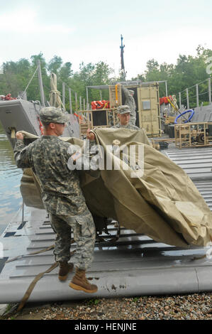 Members of the 326th Quartermaster Company, Newcastle, Pa., set up a ...