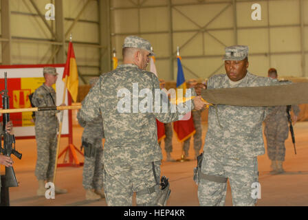 Col. Peter Baker, commander of the 214th Fires Brigade, shakes hands ...