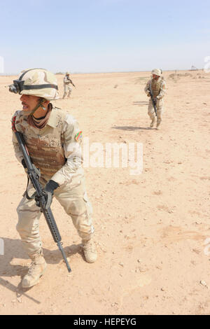 An Iraqi soldier from the 7th Iraqi Army Division receives a ...