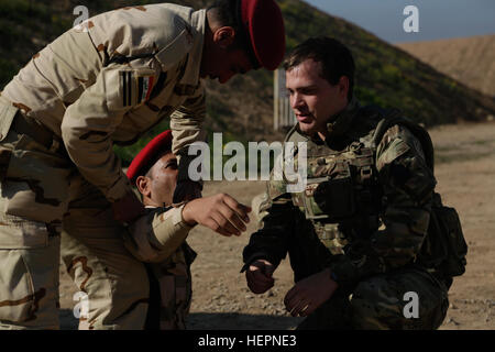 A British Armed Forces Soldier coaches a Ghanaian Army Soldier during a ...