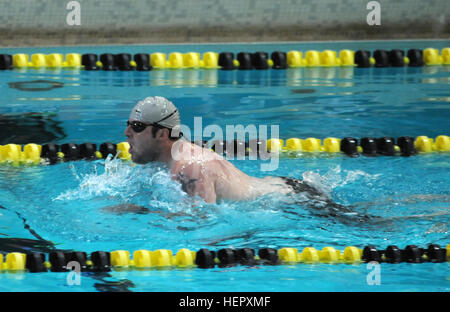 Team SOCOM member Christopher "Lars" Lofgren powers through the water ...