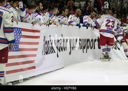 The Kuwait National Hockey Team unveils a banner with the words “Thank ...