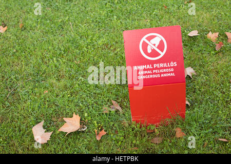 A sign at a zoo warning of dangerous animals Stock Photo - Alamy
