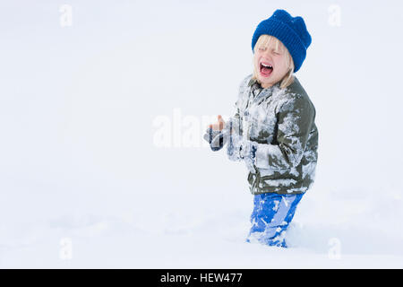 Boy crying in snow Stock Photo - Alamy