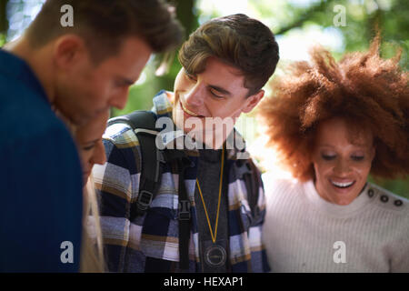 Group of friends smiling in a huddle Stock Photo - Alamy