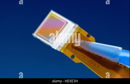 Image sensor against a blue background Stock Photo - Alamy
